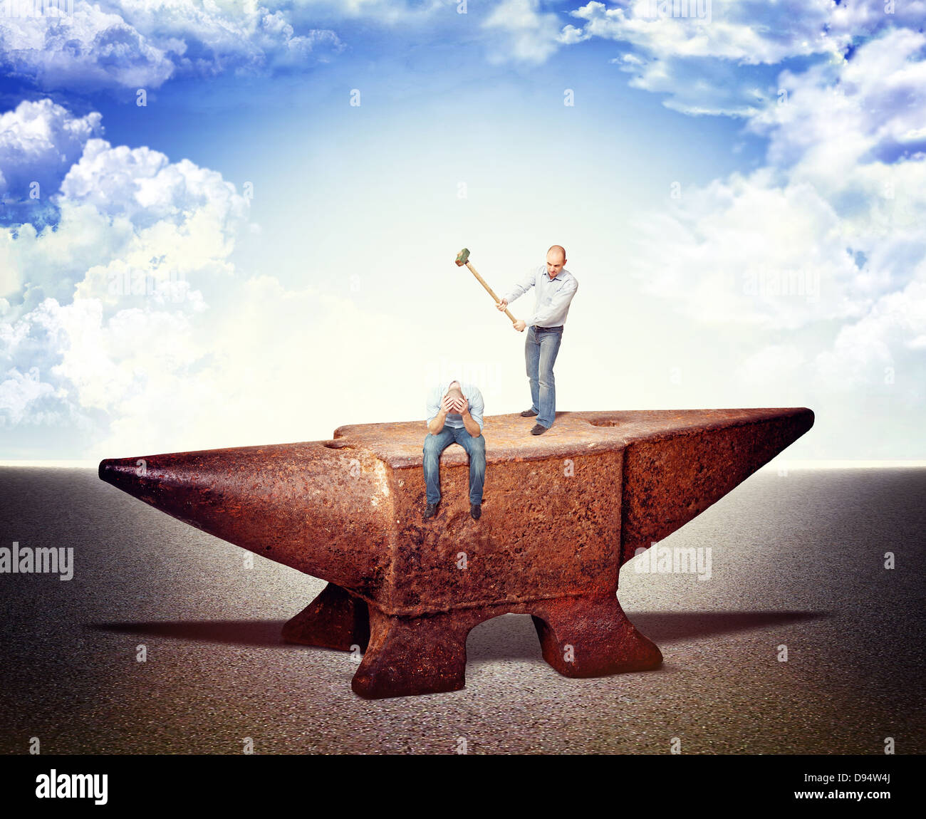 men on iron anvil and sky background Stock Photo - Alamy