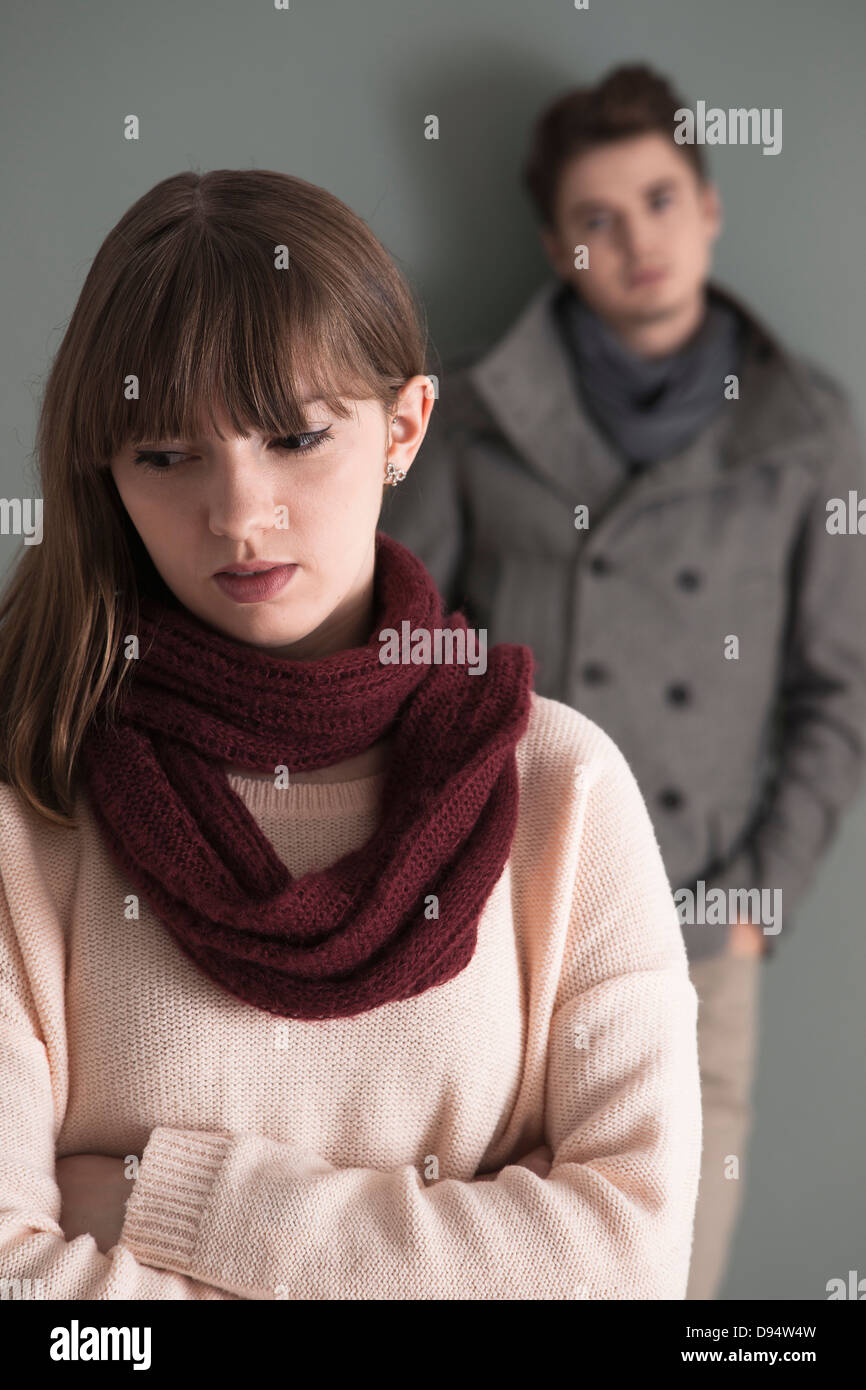 Portrait of Young Man Standing behind Young Woman, Looking at her ...