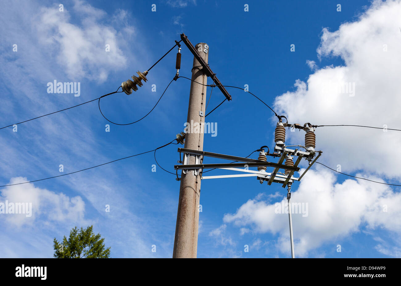 High voltage electricity pylon over blue sky Stock Photo - Alamy