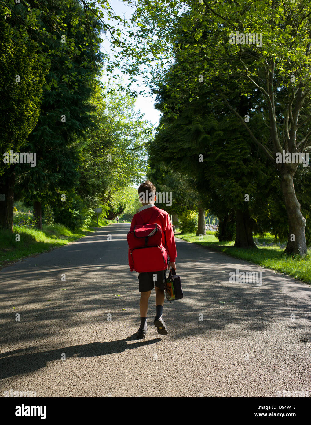 School uniform boy walking hi-res stock photography and images - Alamy