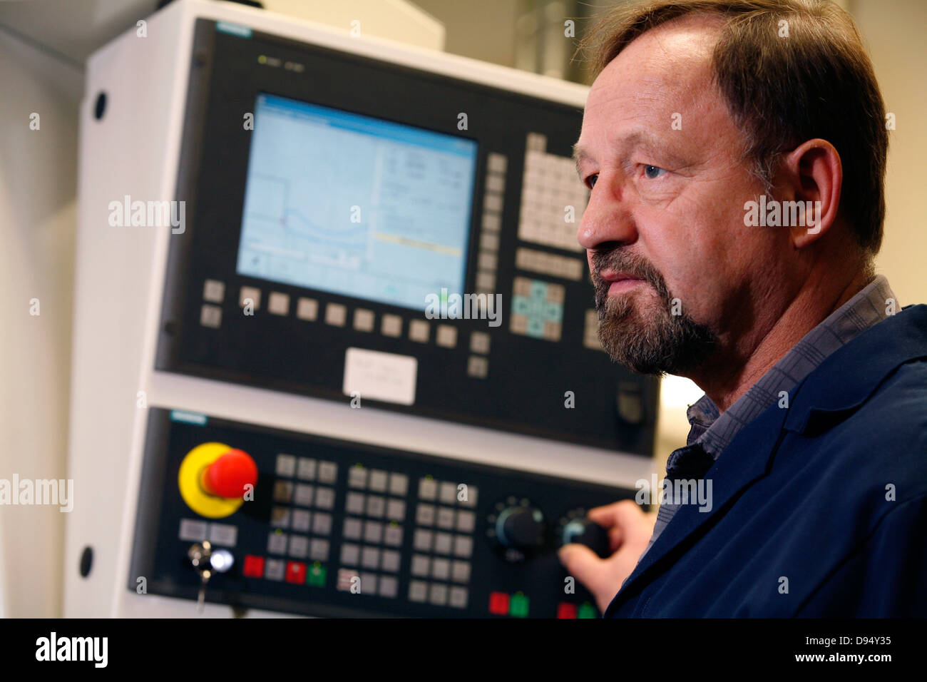 man at operating panel of electrical amchine Stock Photo - Alamy