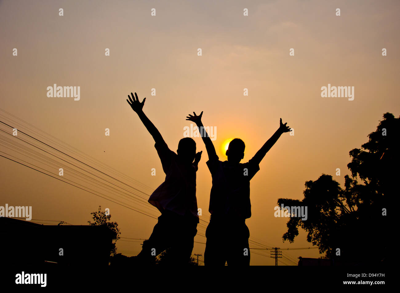 silhouette of boy feel free and happy Stock Photo - Alamy