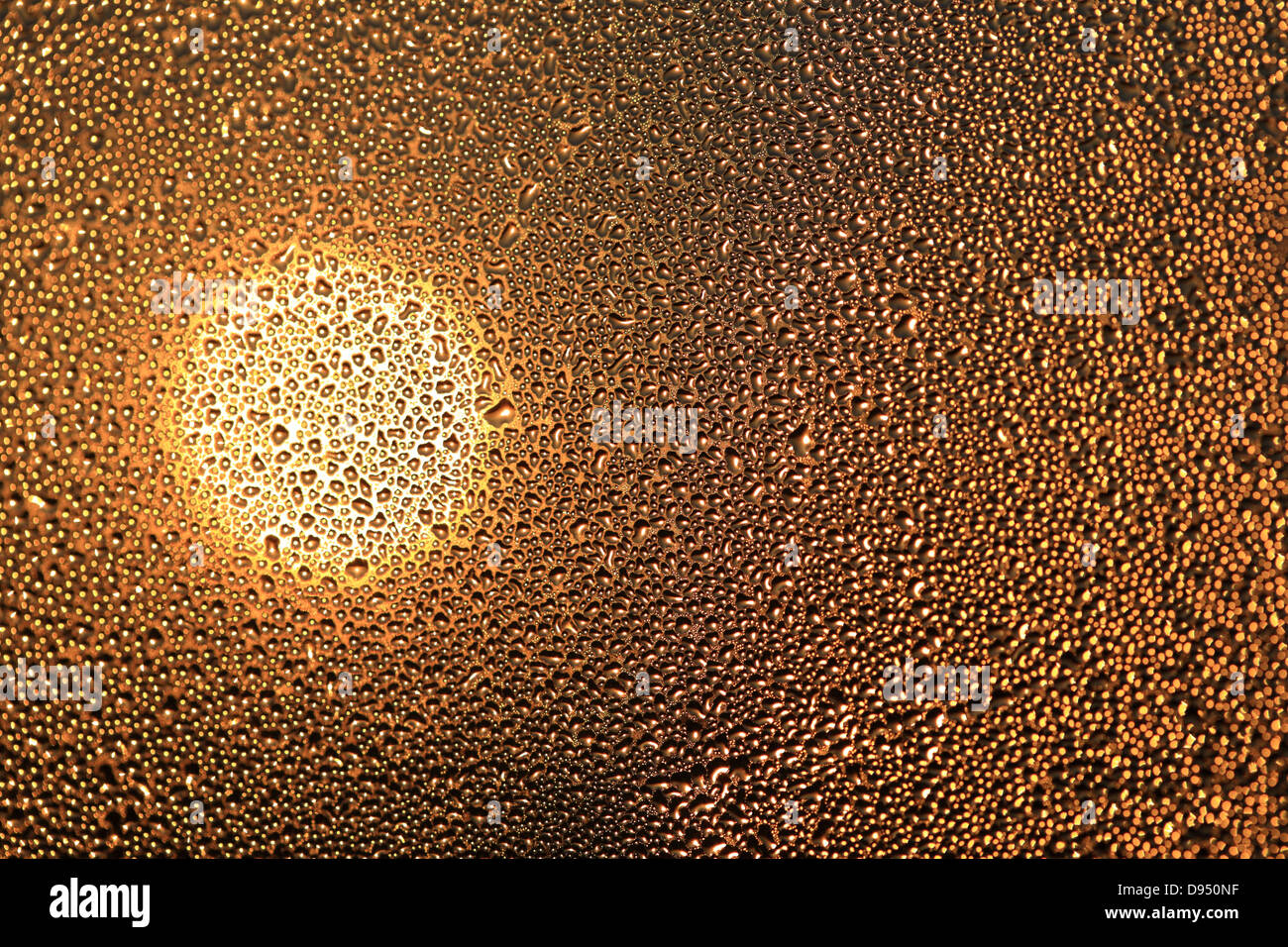 Sunrise viewed through a window covered by condensed dew drops Stock ...