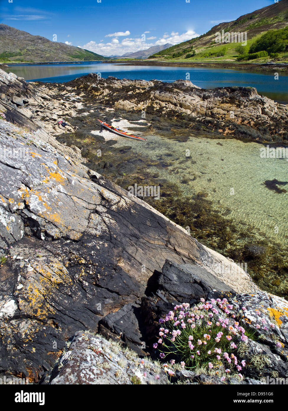 The island of Carna, Loch Sunart, Scotland with sea kayak on beach ...