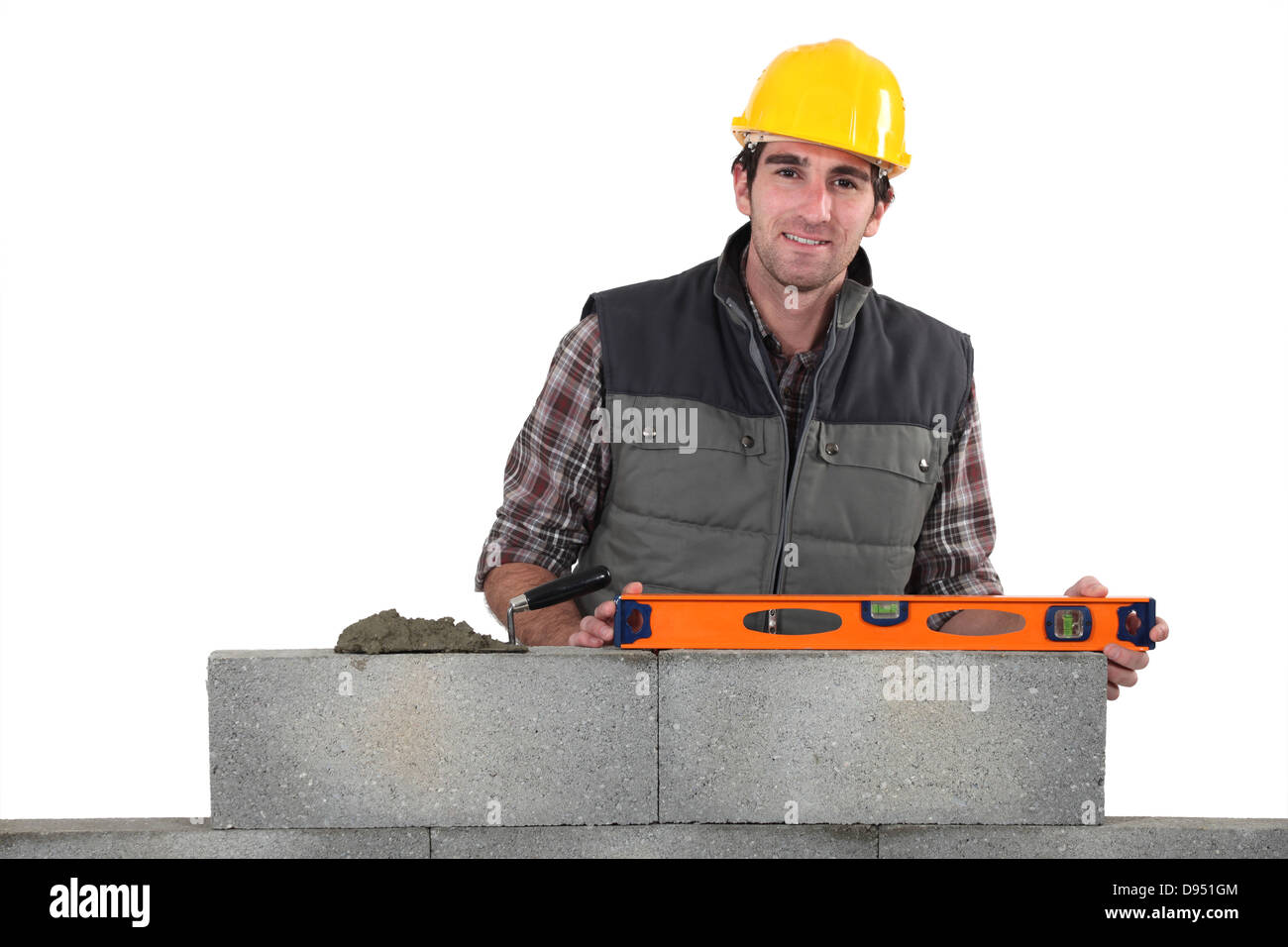 Stonemason using a bubble level Stock Photo - Alamy