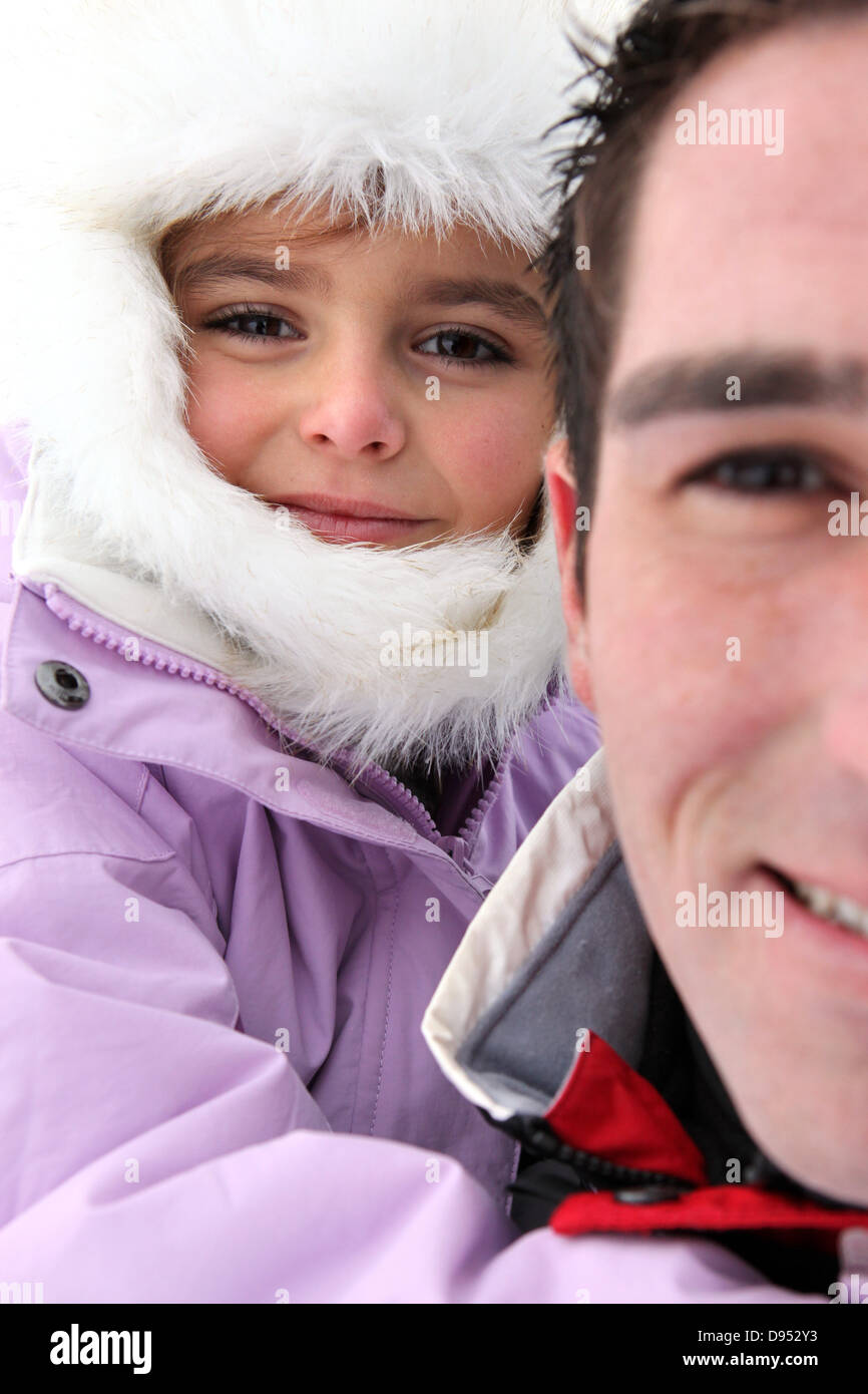 Portrait of a man with little girl by wintertime Stock Photo - Alamy