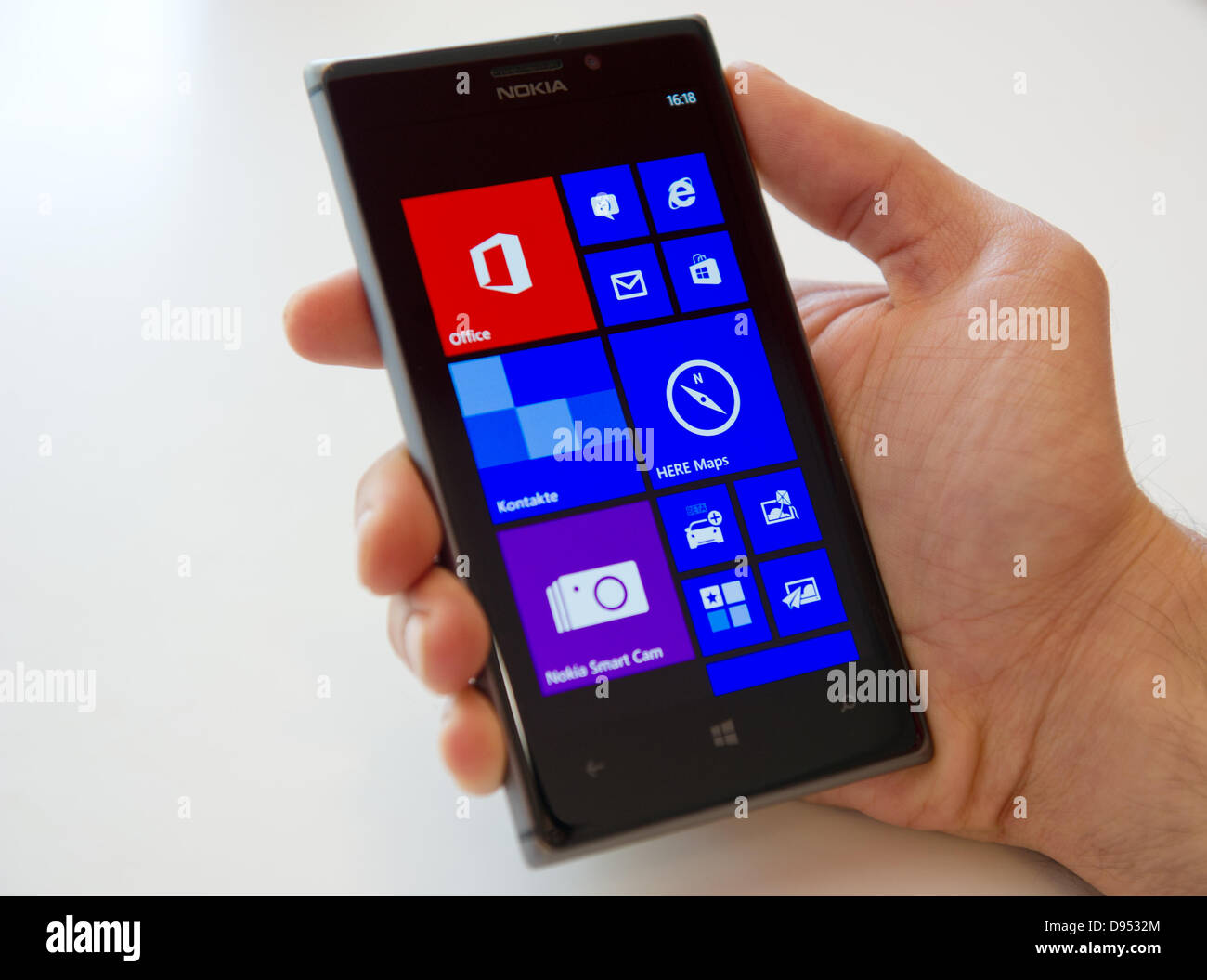 Munich, Germany. 11th June, 2013. Illustration - A person holds a Nokia ...