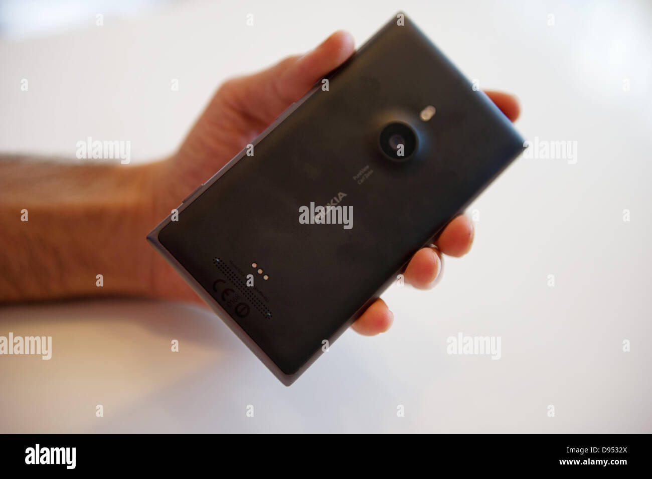 Munich, Germany. 11th June, 2013. Illustration - A person holds a Nokia ...