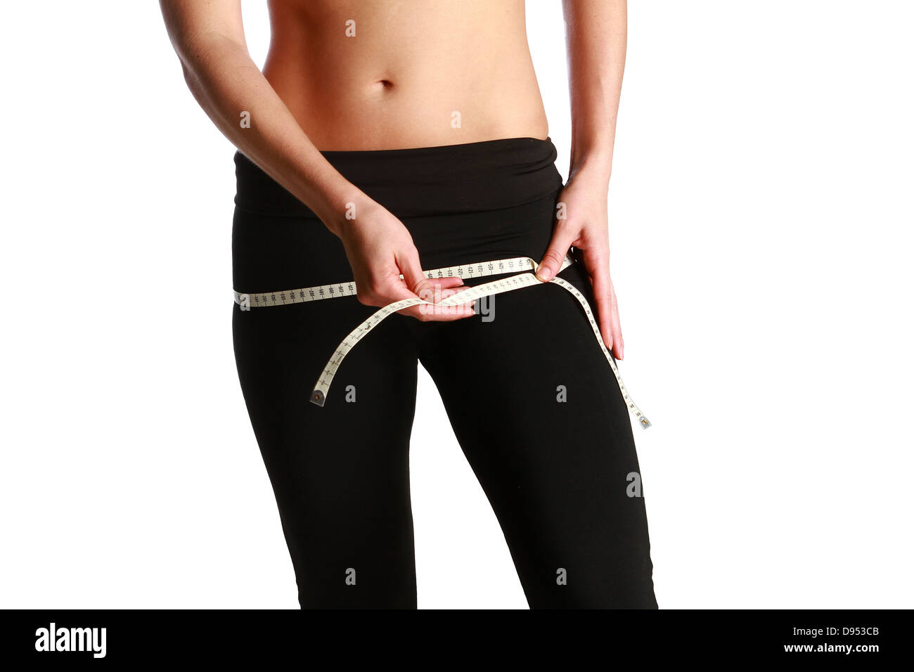 Fitness fanatic is measuring her hip line with a tape, she has been ...