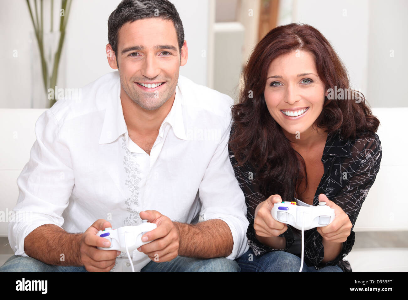 Couple playing computer games Stock Photo - Alamy