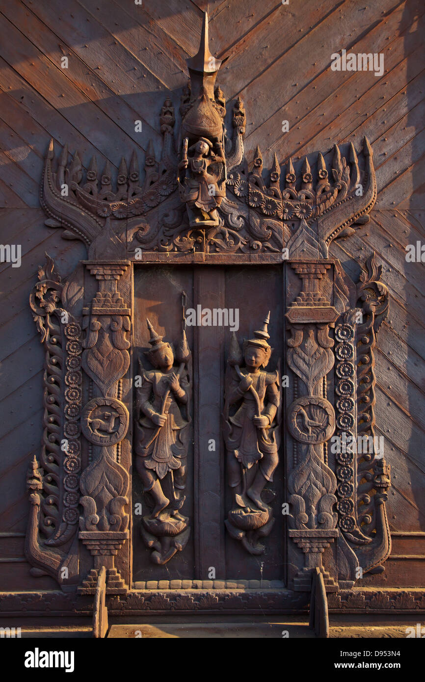 An elaboratly carved door at the SHWE IN BIN KYAUNG known as the TEAK ...