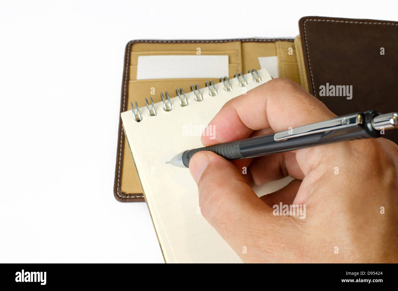 Male hand with pencil writing on blank notepad Stock Photo - Alamy