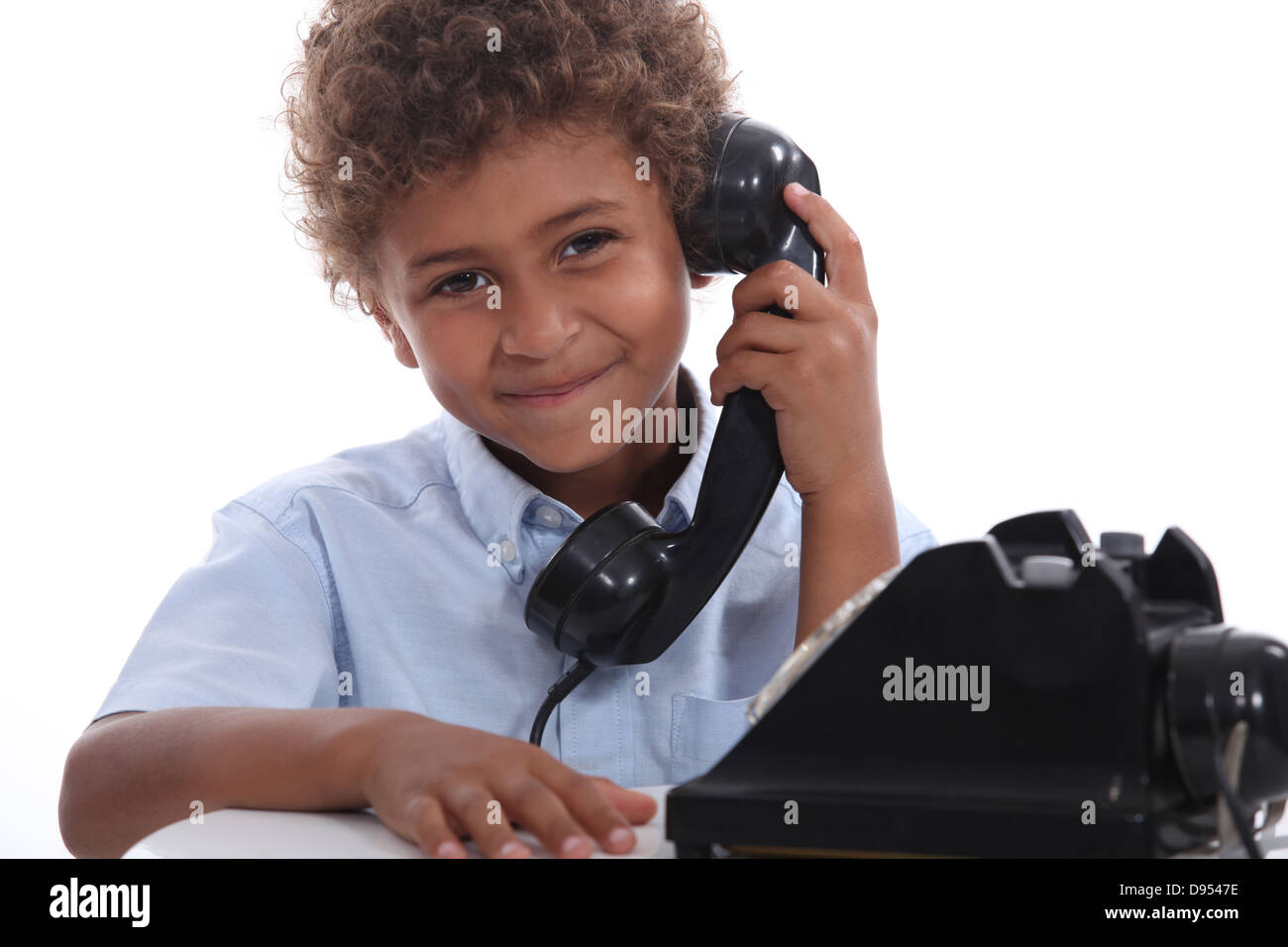 Boy on the telephone Stock Photo - Alamy