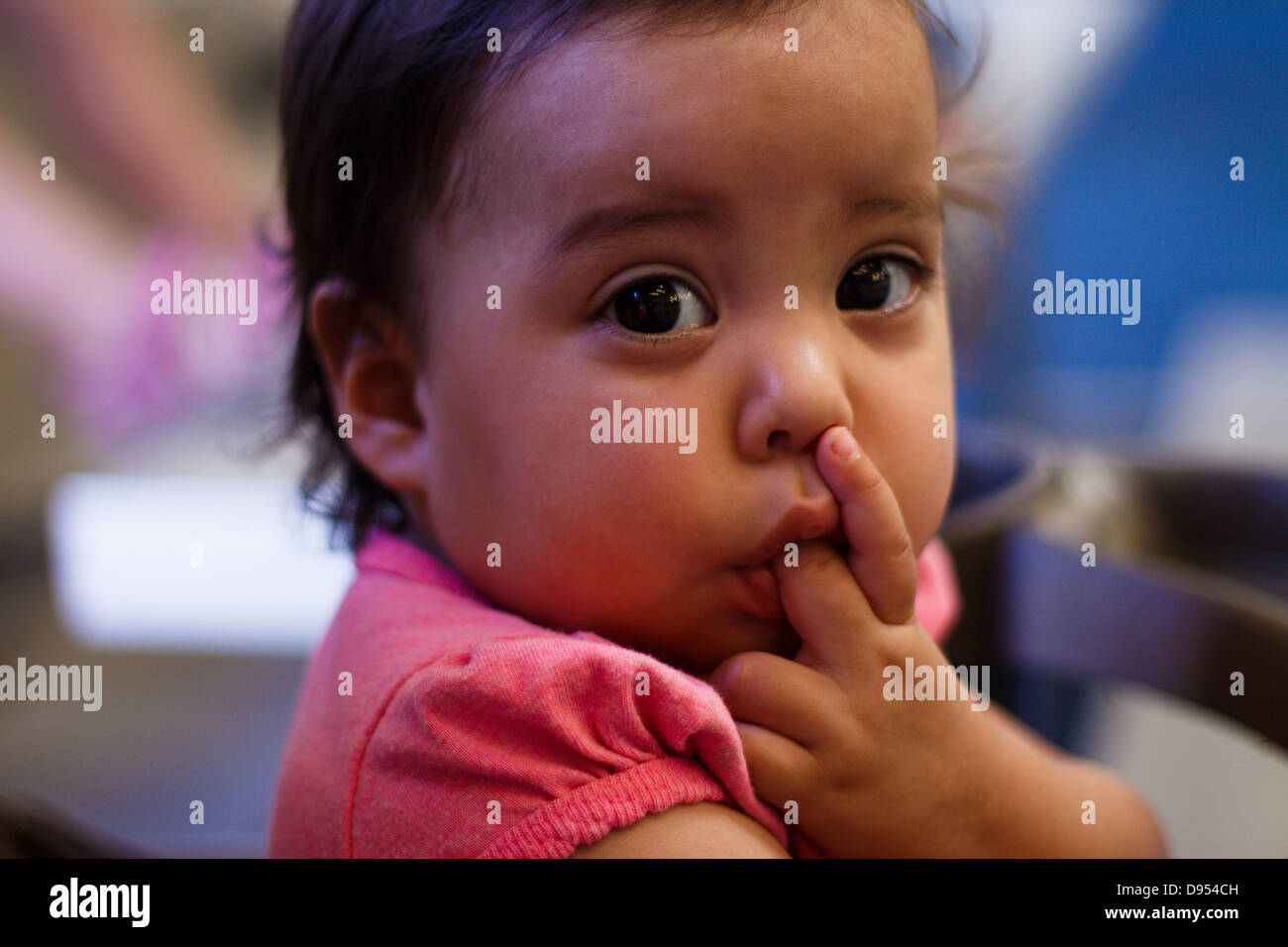 Baby girl looking serious or scared Stock Photo - Alamy