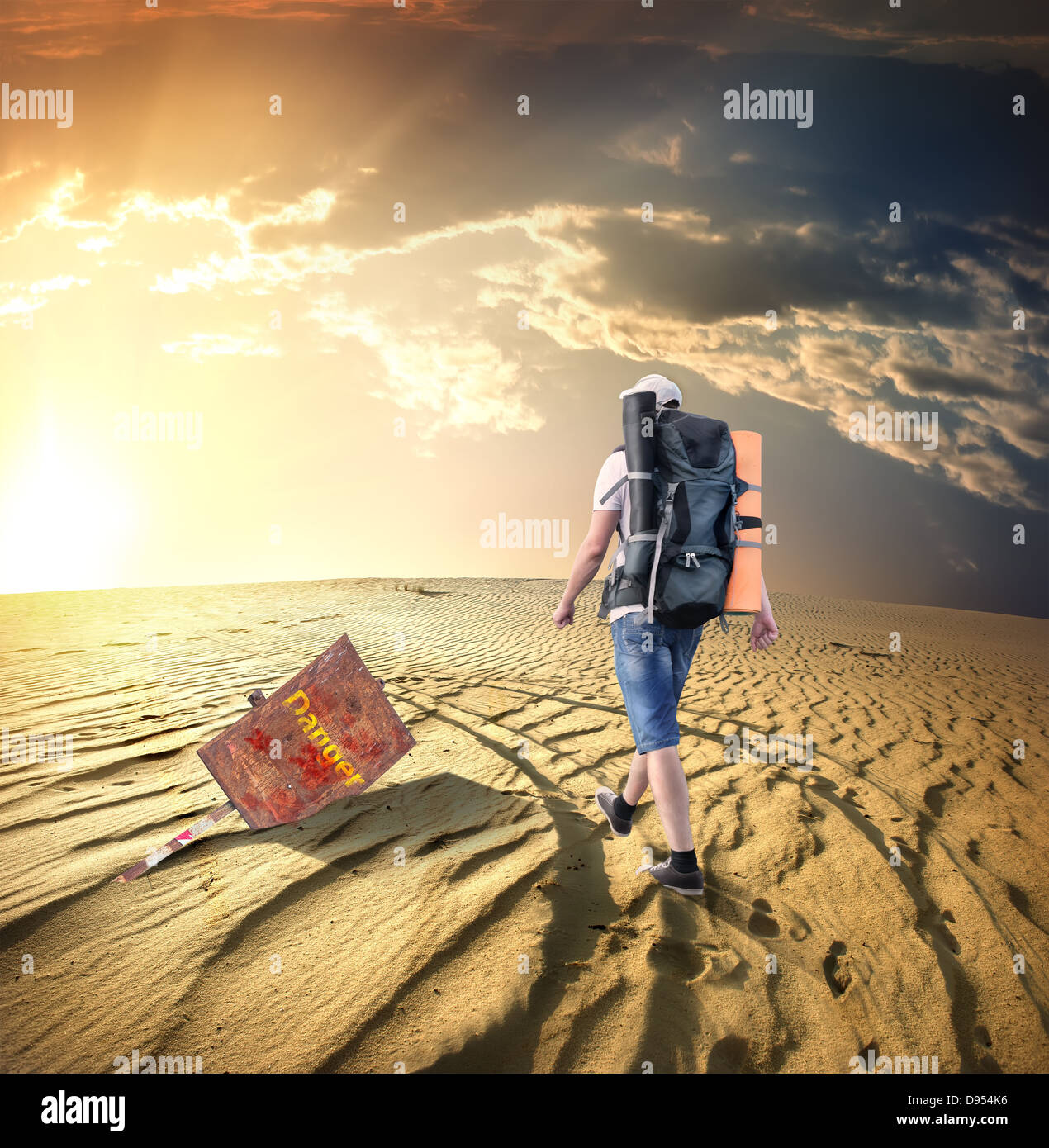 Man with a backpack traveling in the desert Stock Photo - Alamy