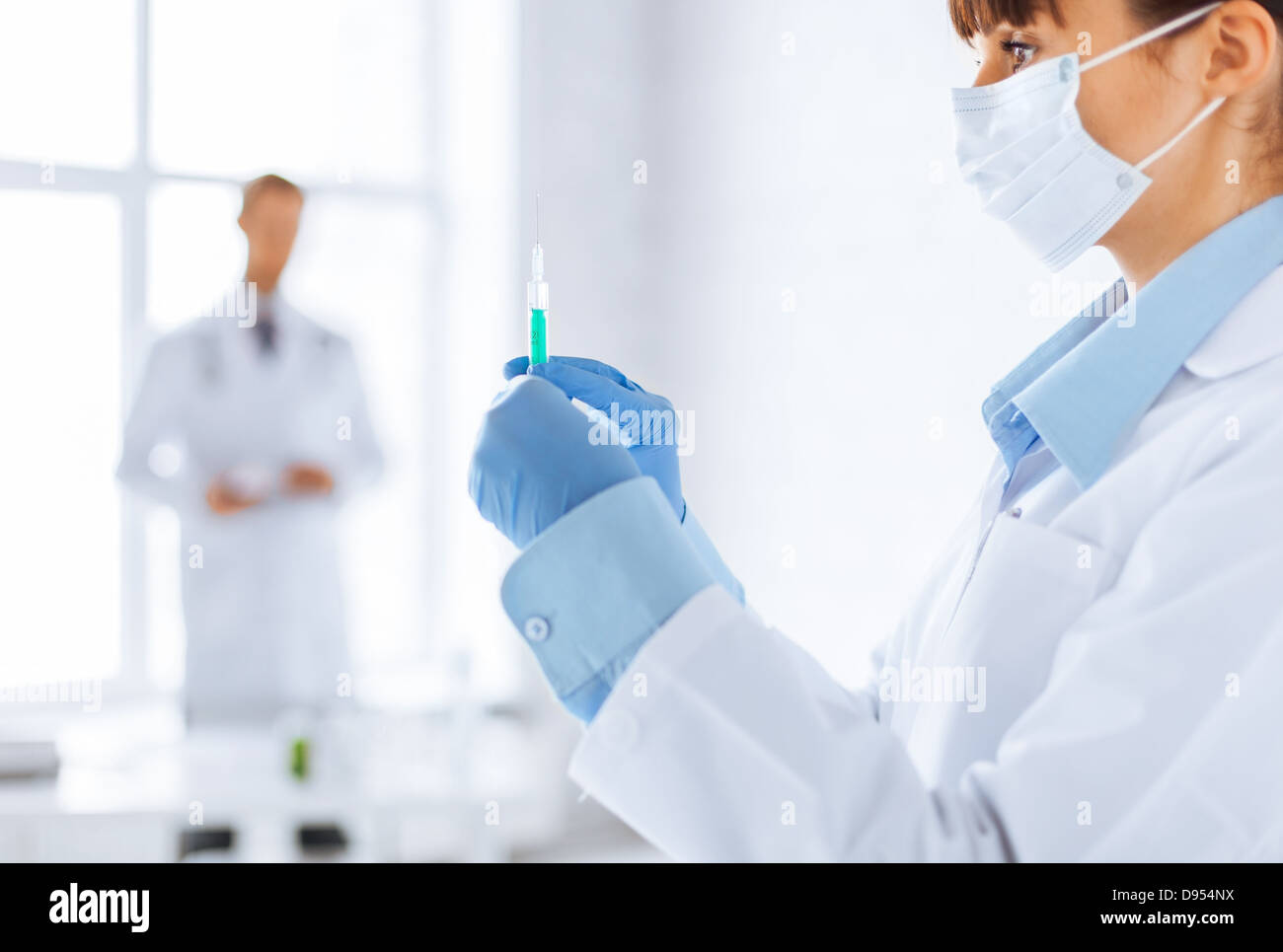 female doctor holding syringe with injection Stock Photo - Alamy