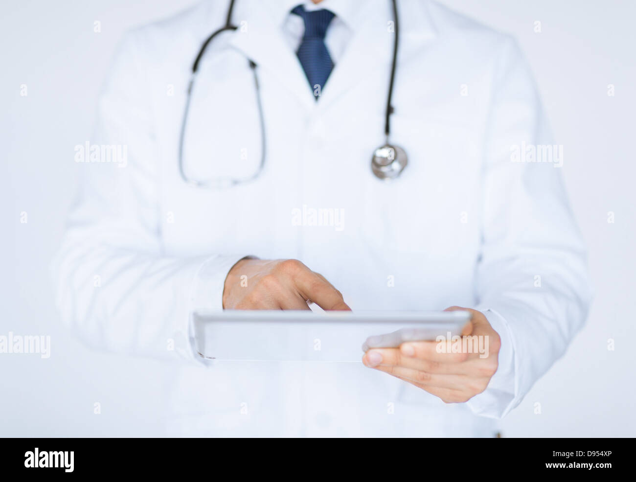 male doctor holding tablet pc Stock Photo - Alamy