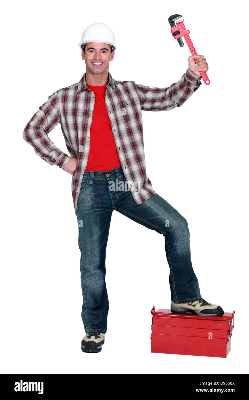 Man stood with one foot on tool box Stock Photo - Alamy