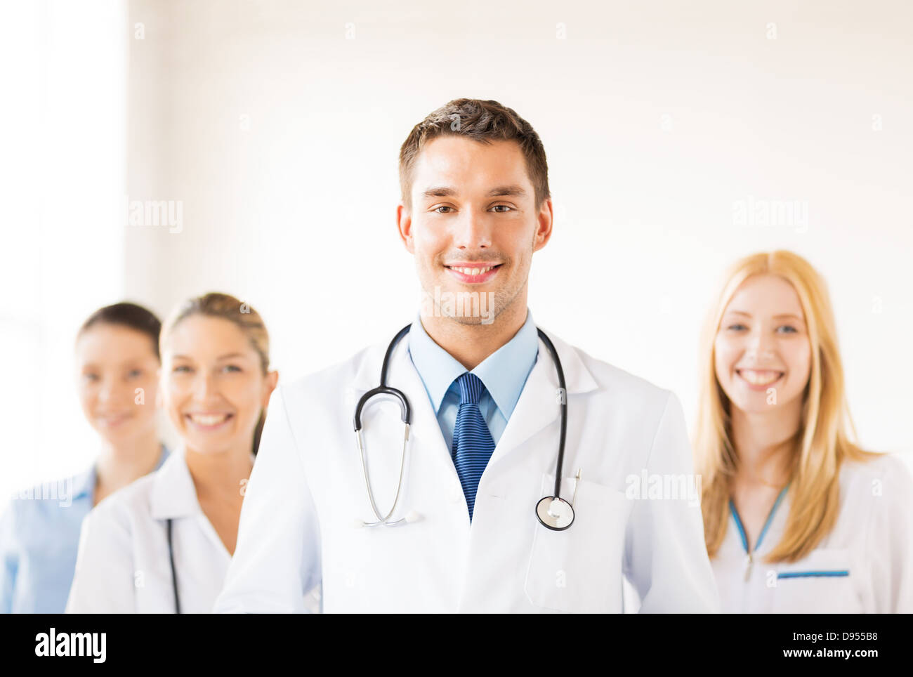 male doctor in front of medical group Stock Photo - Alamy