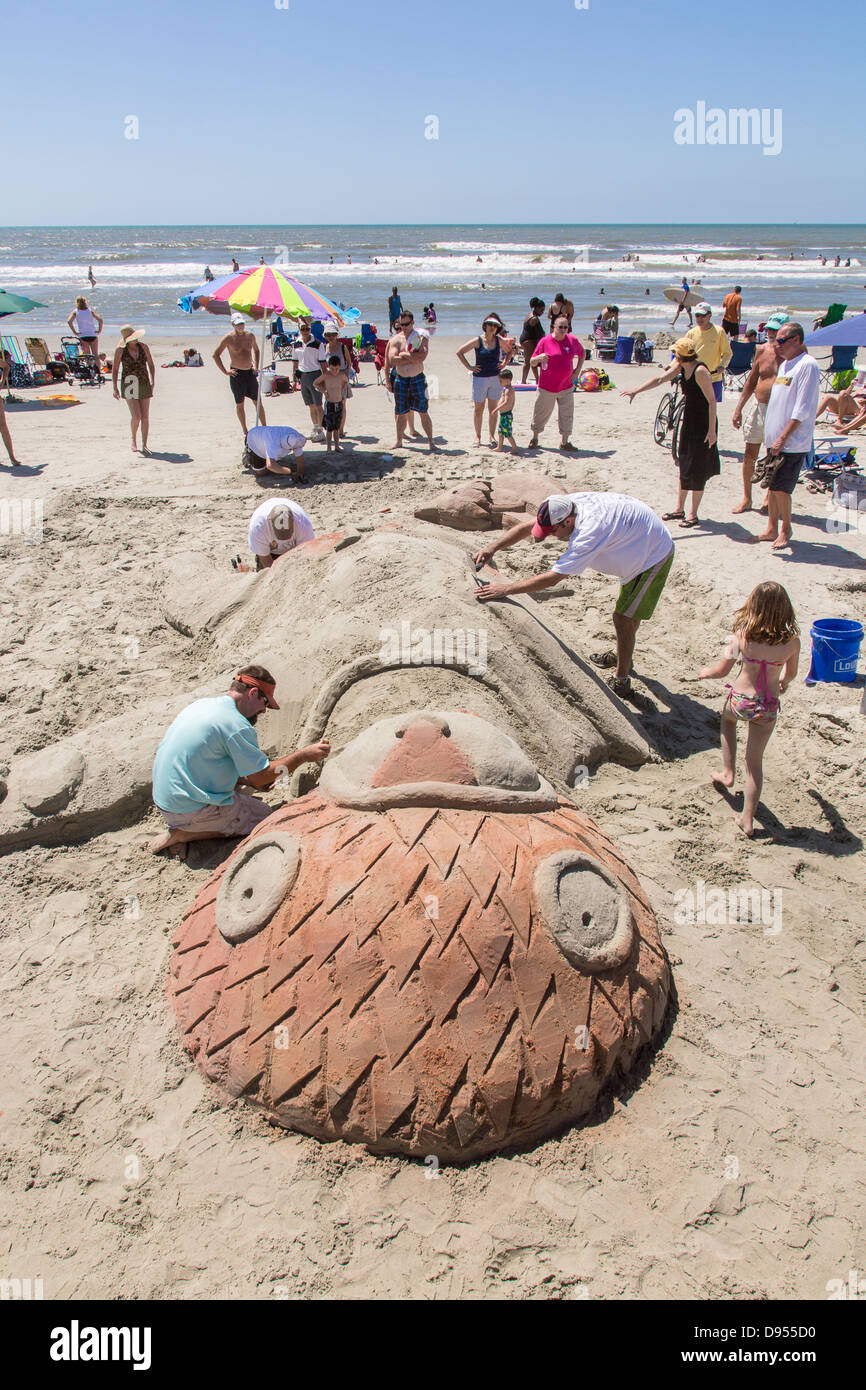Contestants work on creating sand sculptures during the Spoleto ...