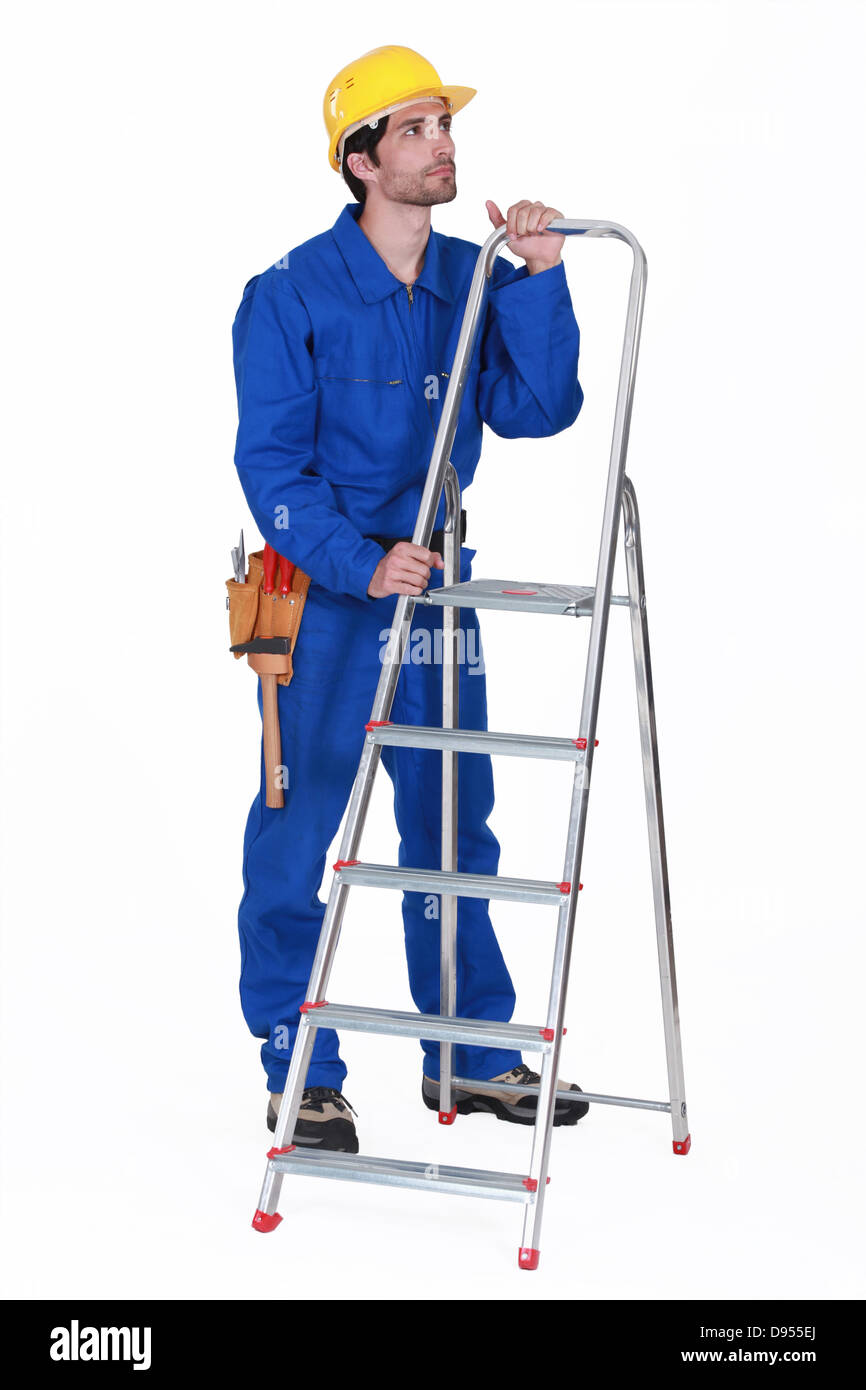 Manual worker stood with step-ladder Stock Photo - Alamy