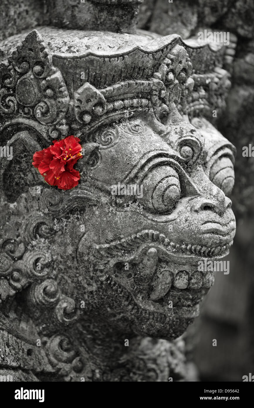 The old stone statue of Balinese god close up Stock Photo - Alamy