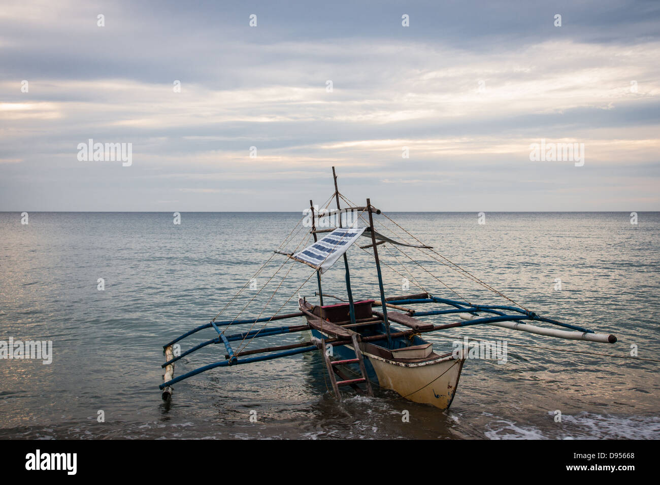Traditional outrigger fishing boat fitted as tourist transport at Sugar ...