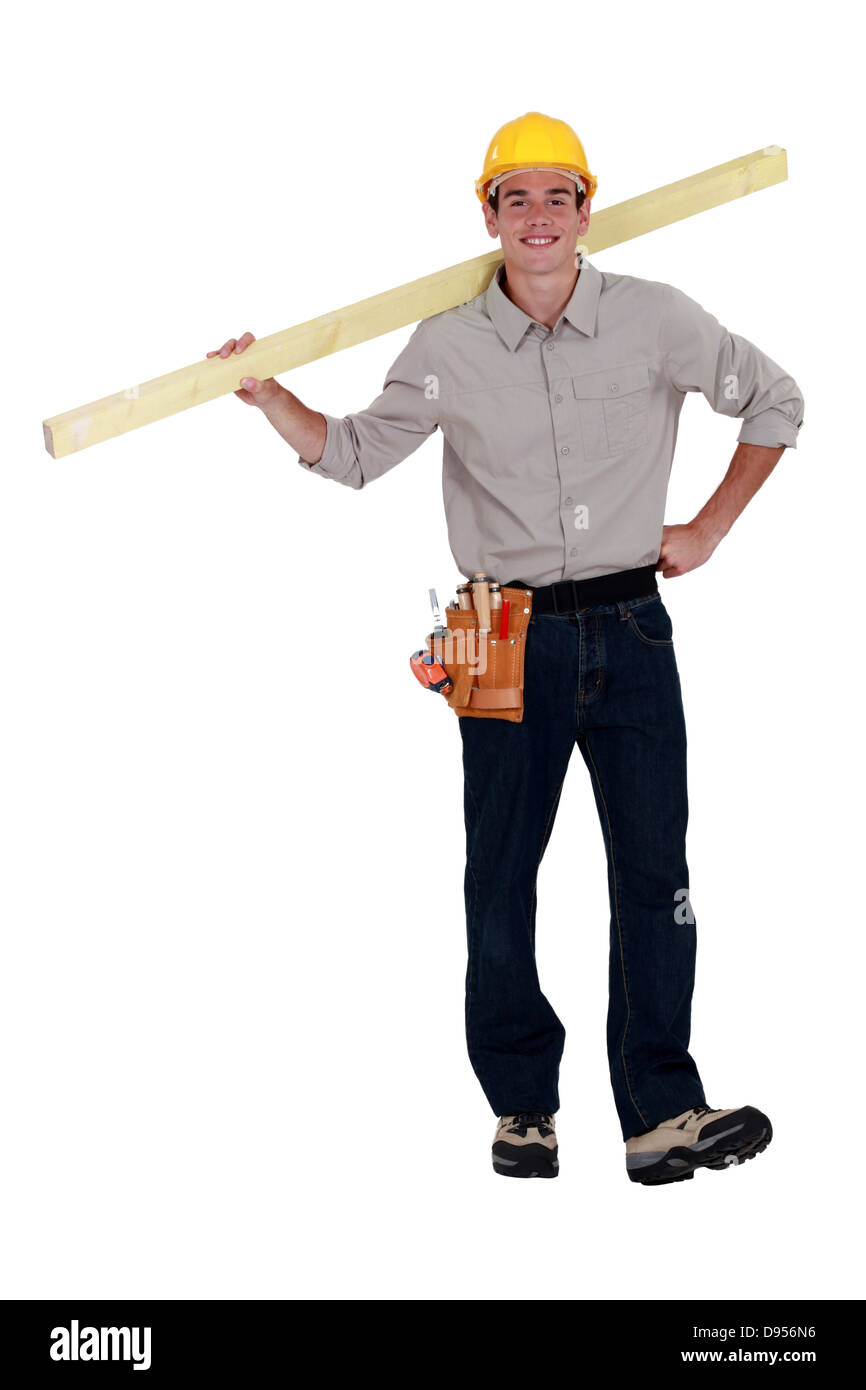 Worker carrying wood construction Cut Out Stock Images & Pictures - Alamy