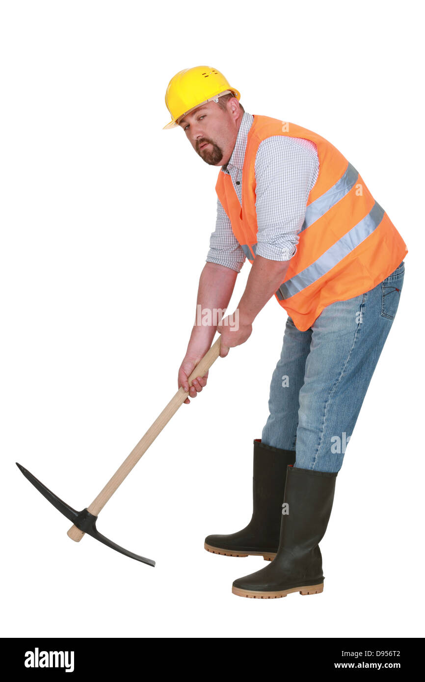 Construction worker with pickaxe on white background Stock Photo - Alamy