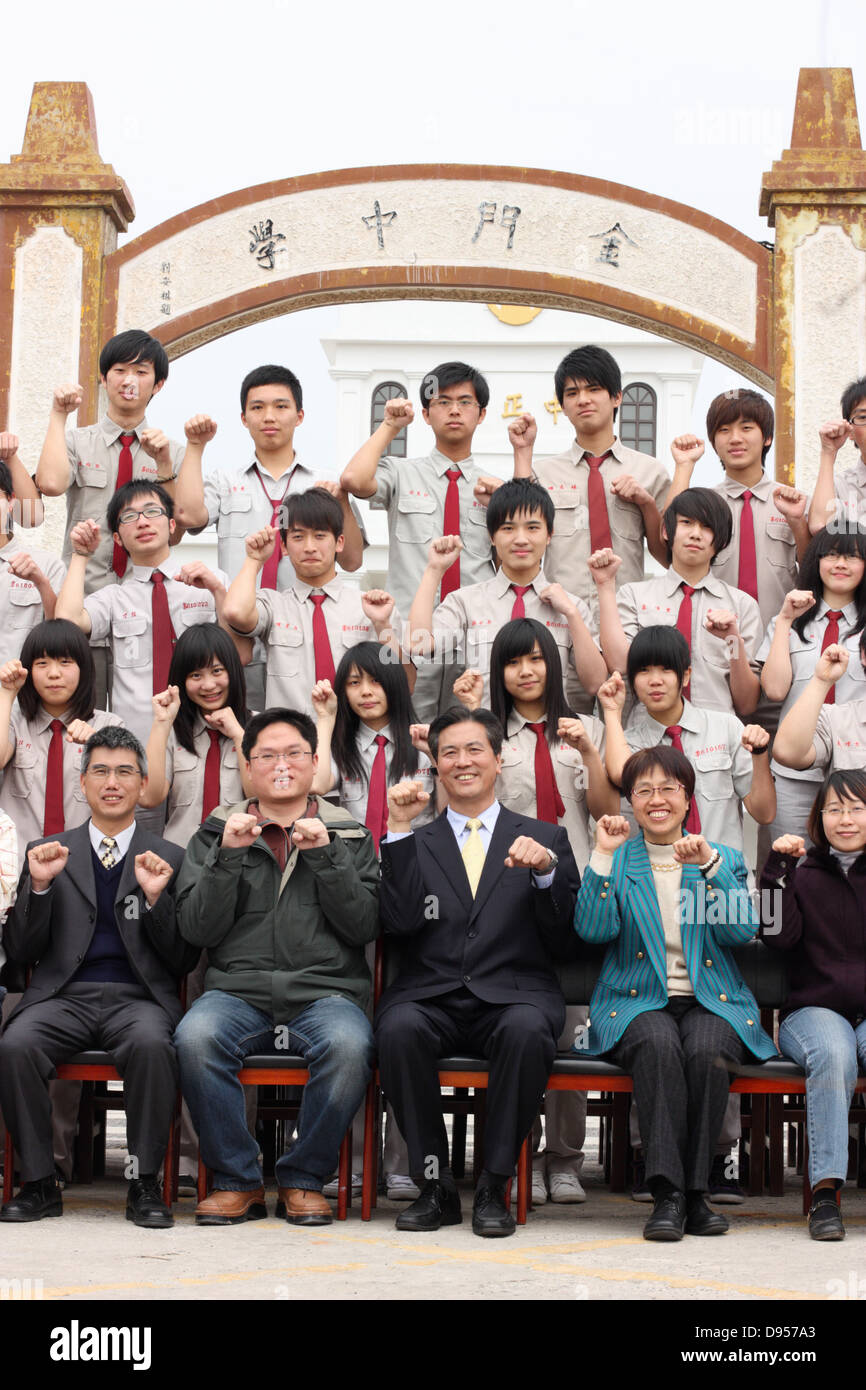 Middle school students pose for a class photo with administrators at ...