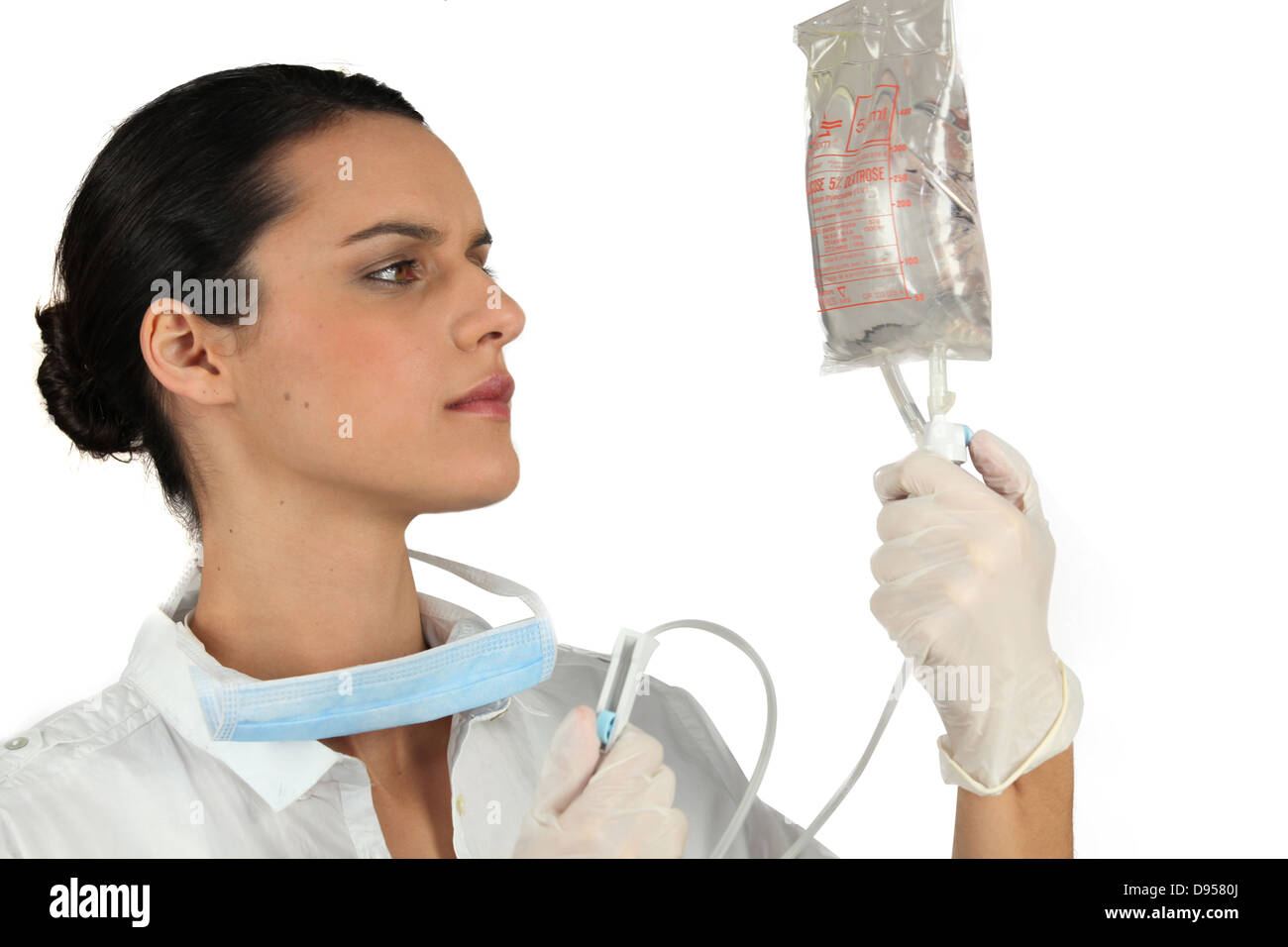 Hospital nurse examining a drip Stock Photo - Alamy