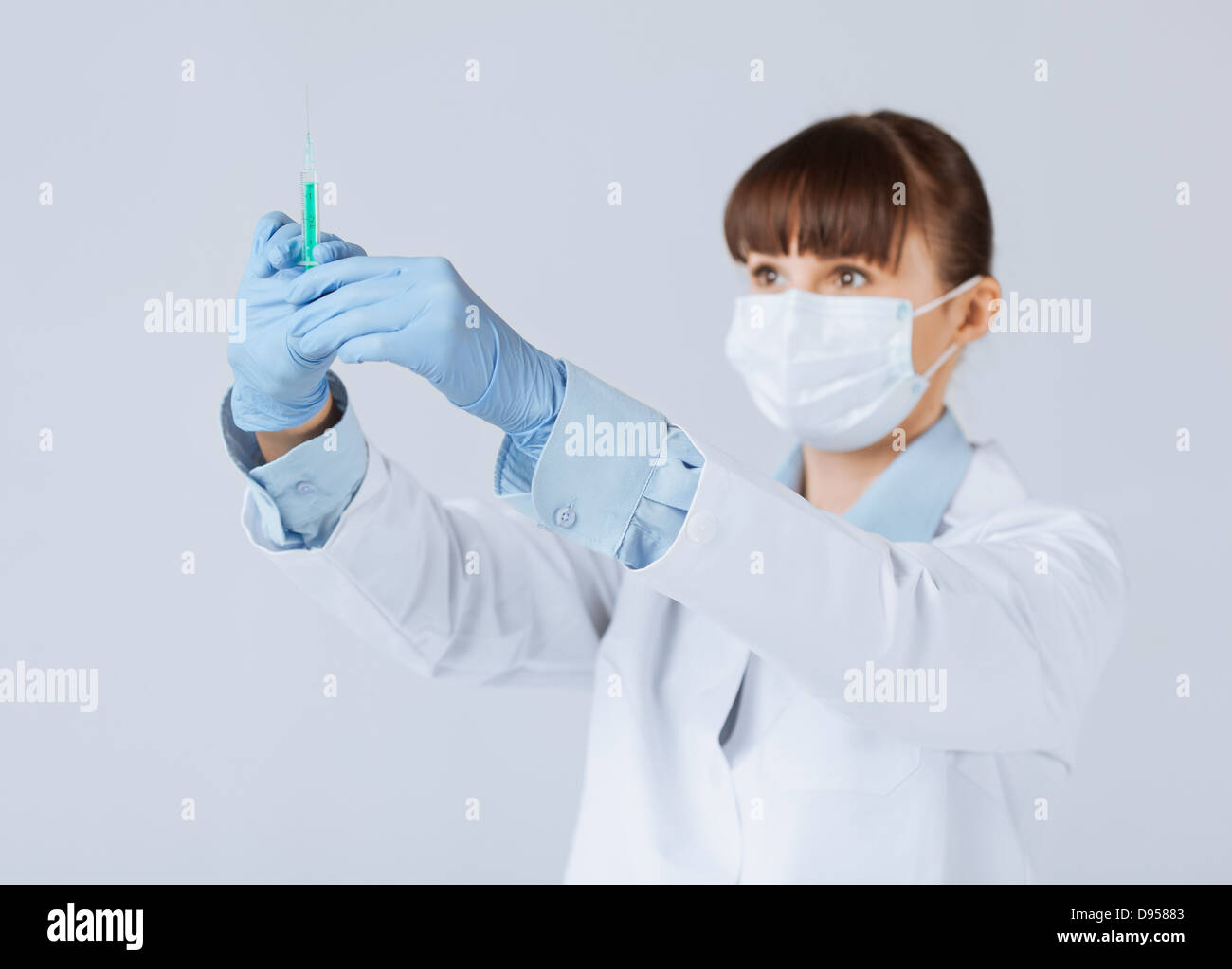 female doctor holding syringe with injection Stock Photo - Alamy