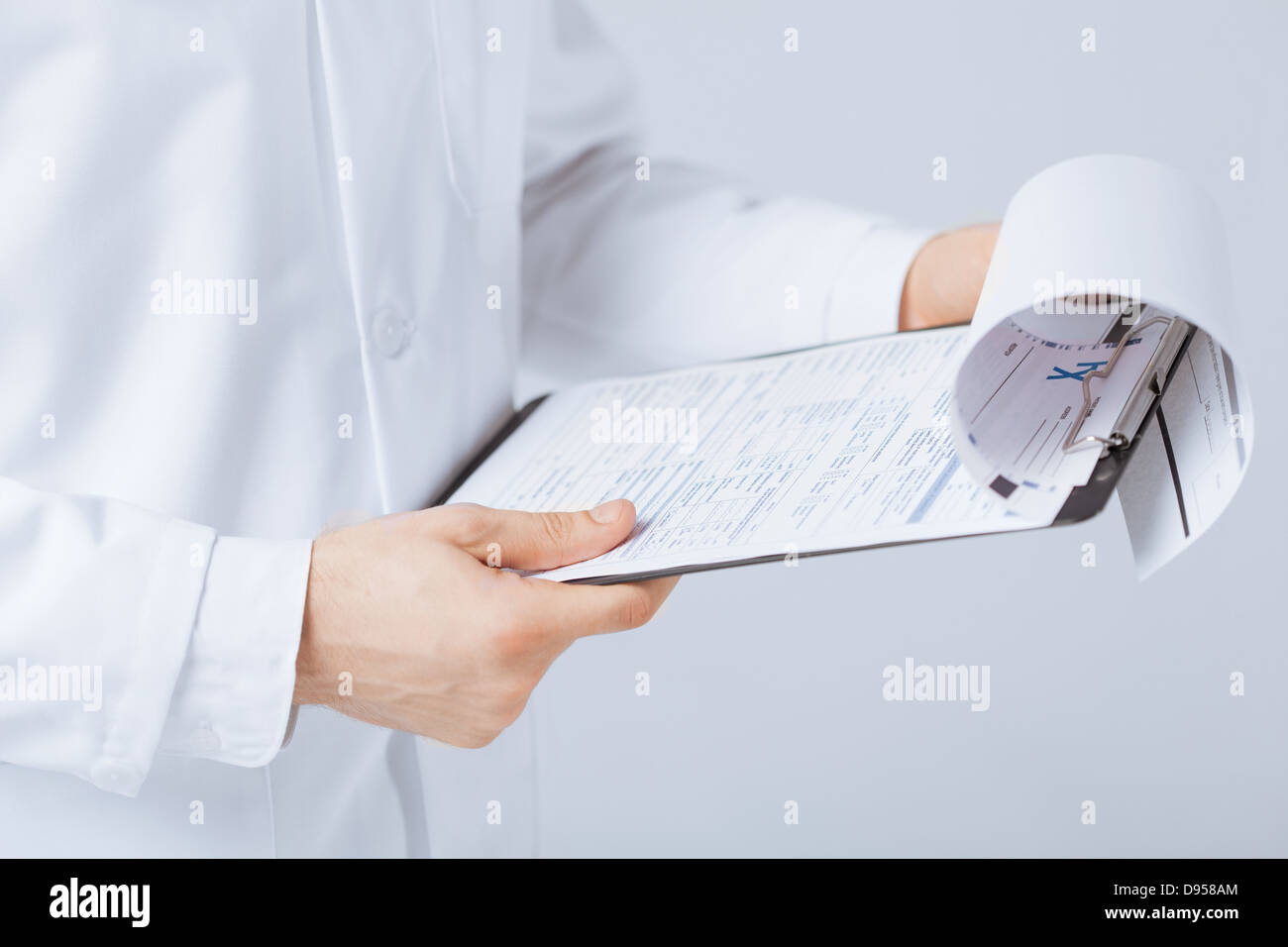 male doctor holding prescription paper in hand Stock Photo - Alamy