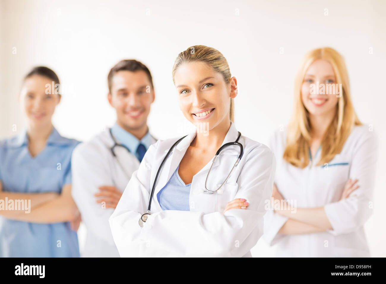 female doctor in front of medical group Stock Photo - Alamy
