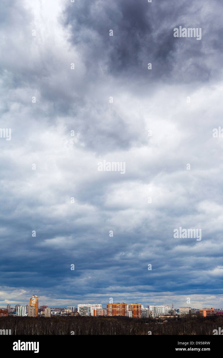 dark gray storm rainy clouds under city in spring evening Stock Photo ...