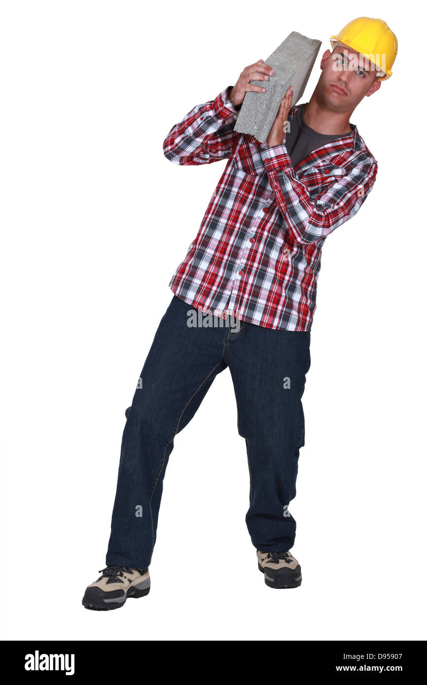 Mason shifting bricks Stock Photo - Alamy