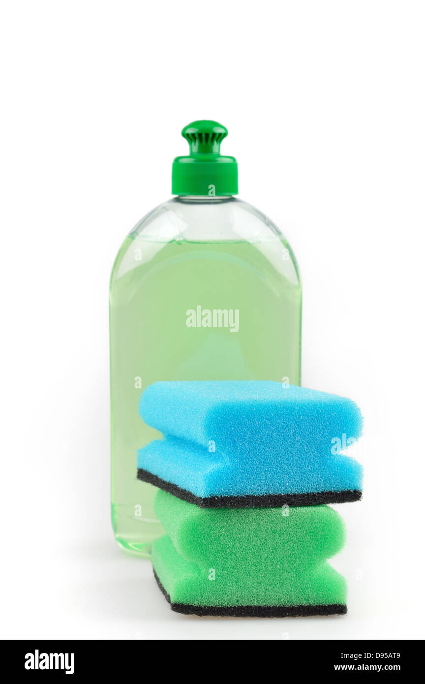 Detergent. Green dishwashing liquid and sponges isolated on white ...