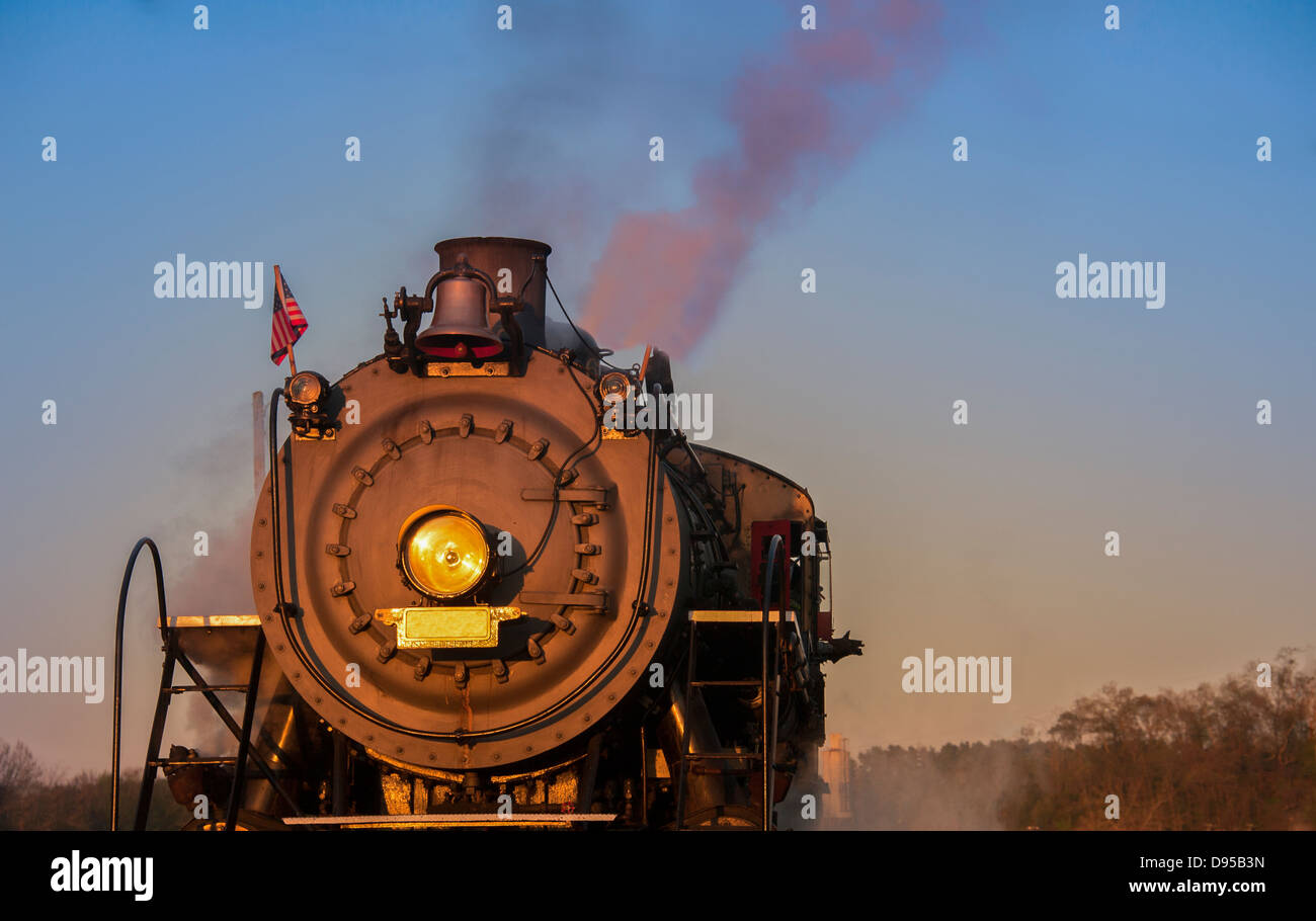 An antique steam engine rolls on the tracks in North Carolina. This ...