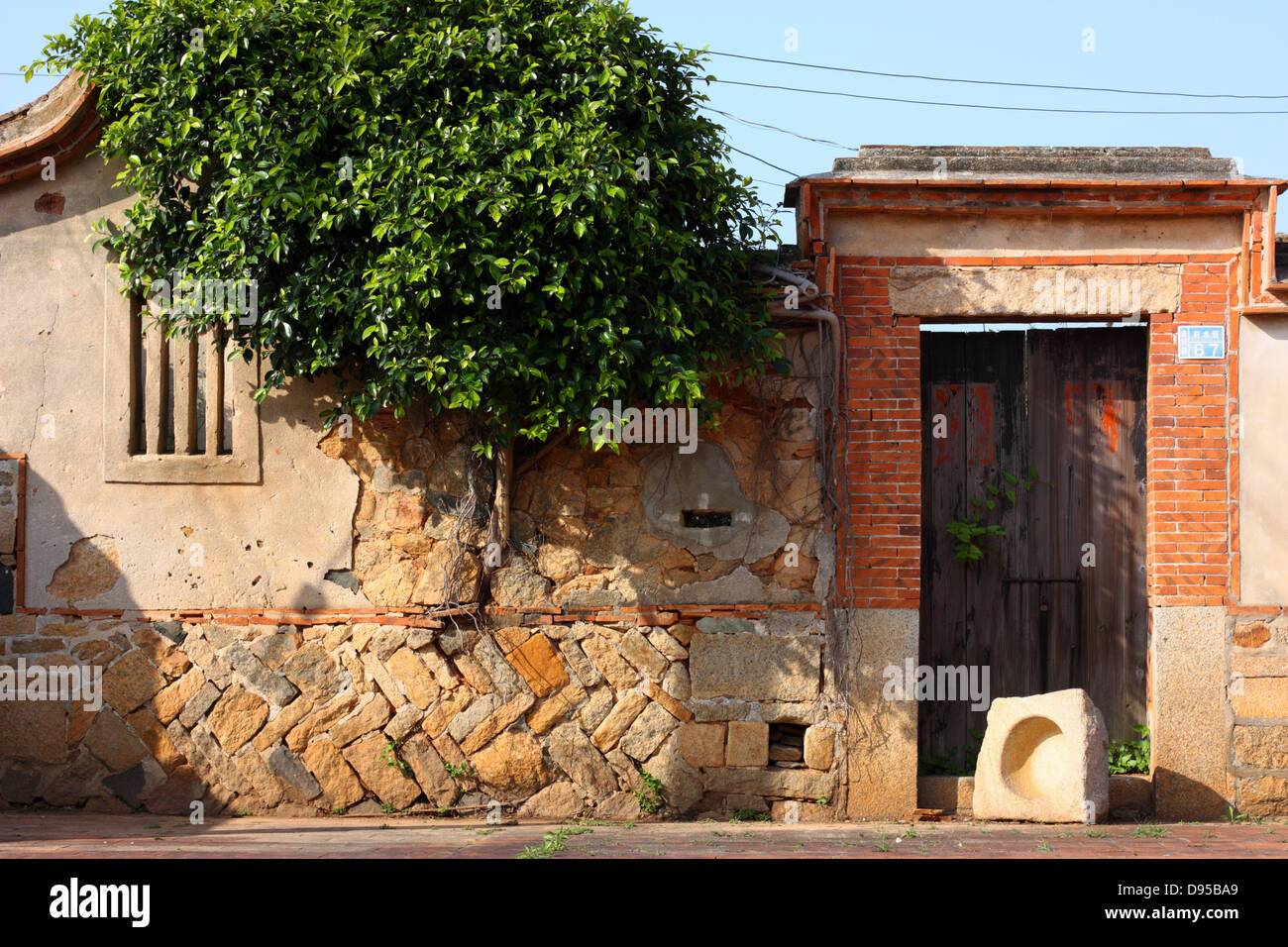 An old overgrown traditional house. Kinmen National Park, Shuitou ...
