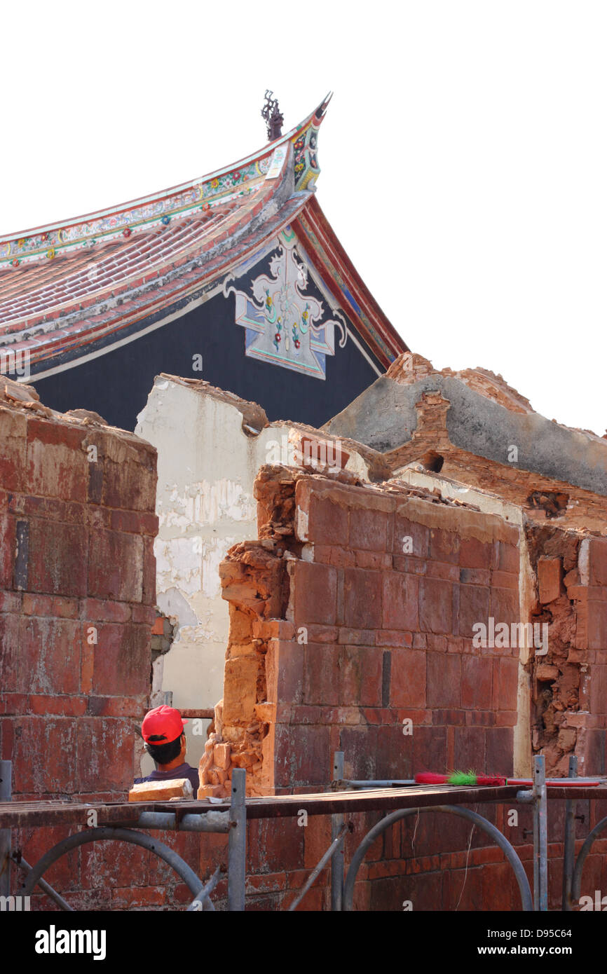 Old traditional houses being restored and a house with swallow tail ...