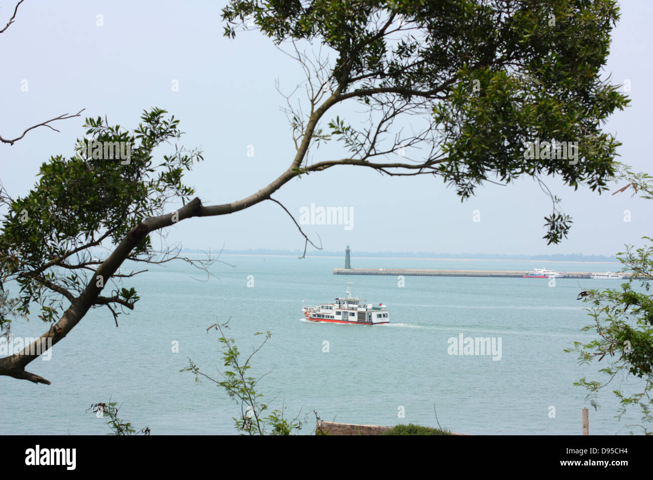 A ferry leaves Shuitou Harbor for Little Kinmen (Lieyu). Kinmen County ...