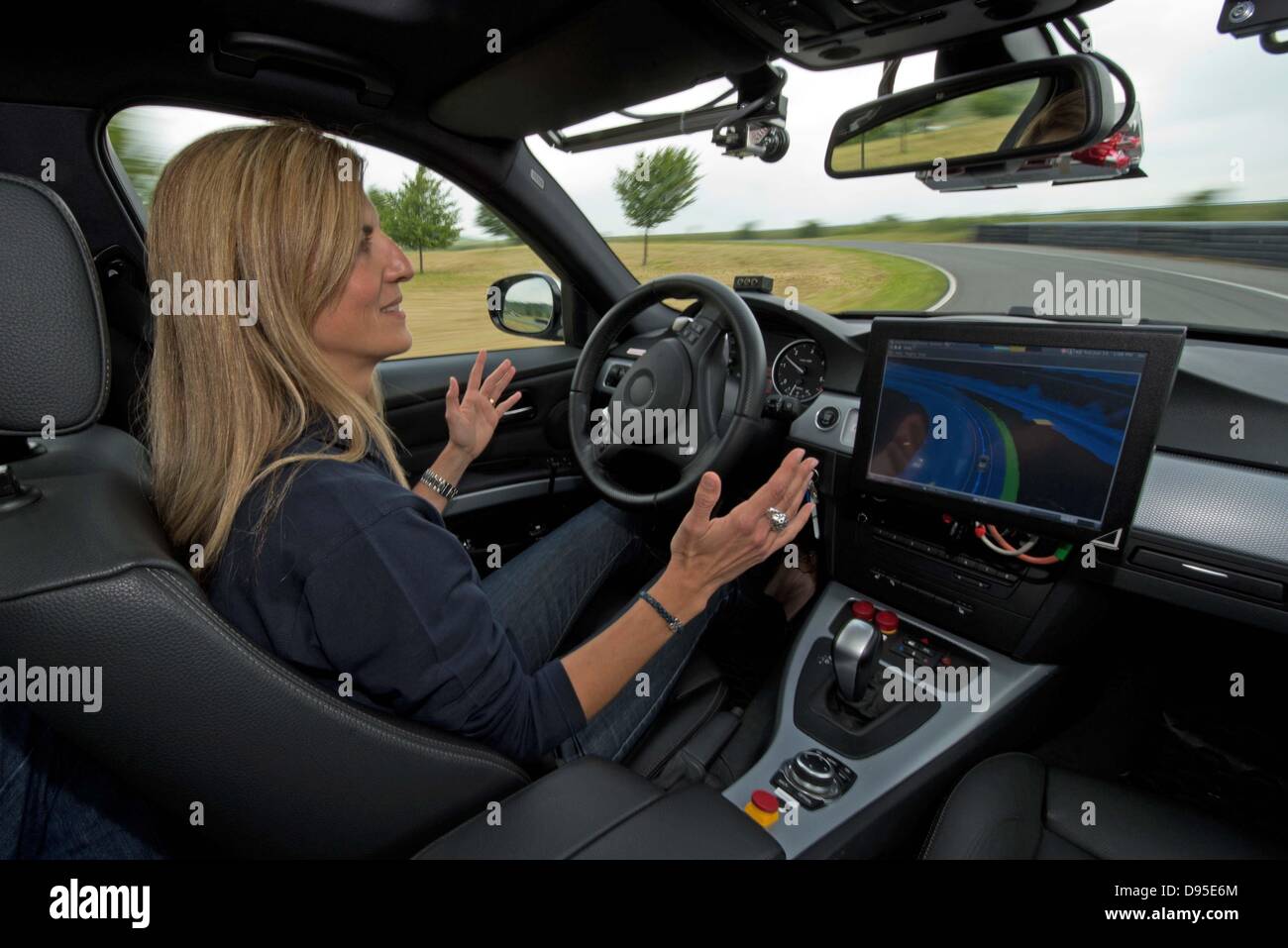 An employee of Bosch drives a car equipped with technology for ...