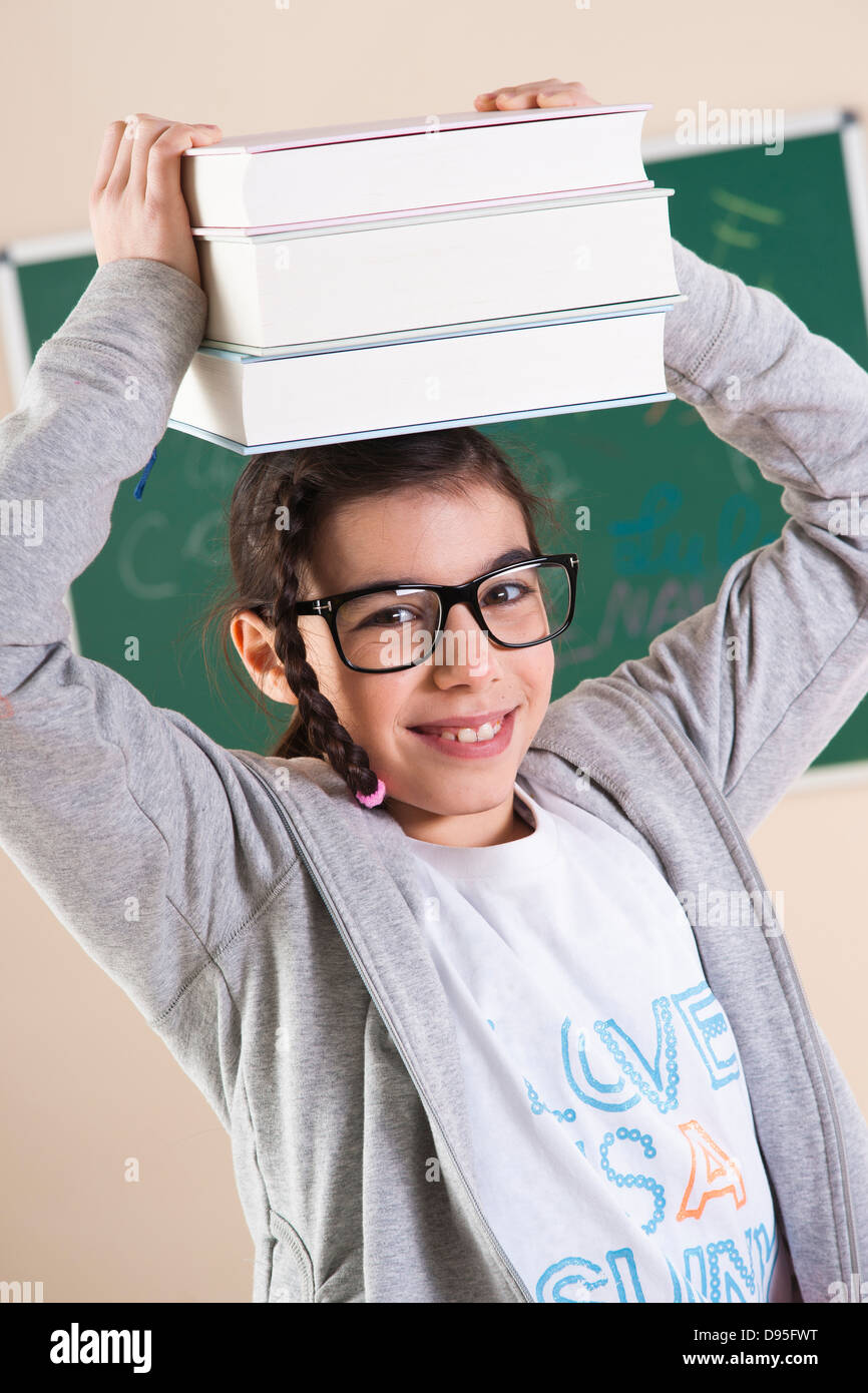 Girl carrying book hi-res stock photography and images - Alamy
