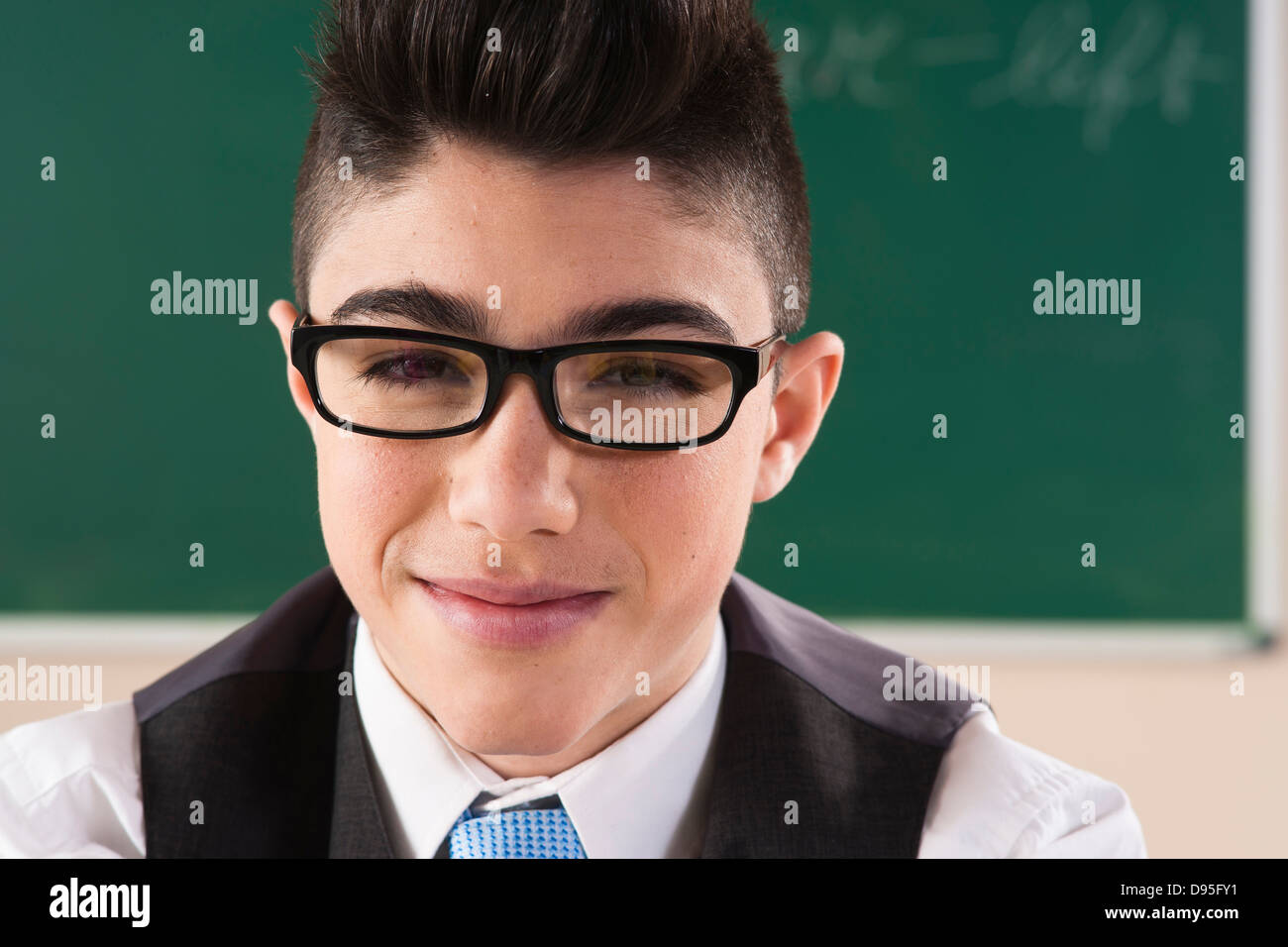Close-up Portrait of Boy in front of Chalkboard in Classroom Stock ...