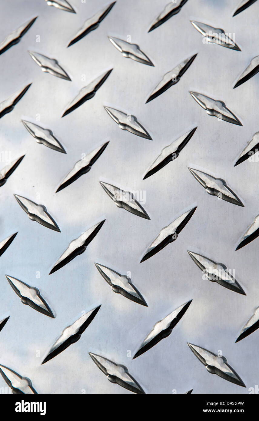 Stainless steel diamond plate facade with reflection of clouds Stock ...