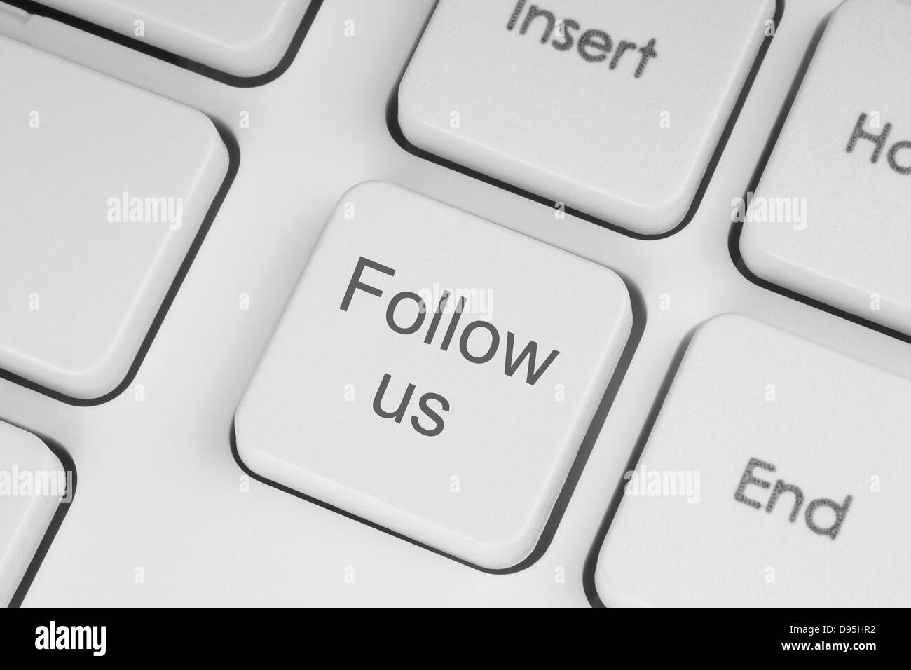 Follow us button on keyboard background Stock Photo - Alamy