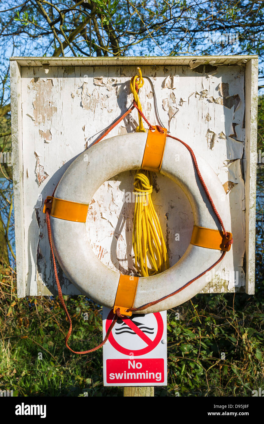 Lifebuoy on a lakeside with No Swimming instruction Stock Photo - Alamy