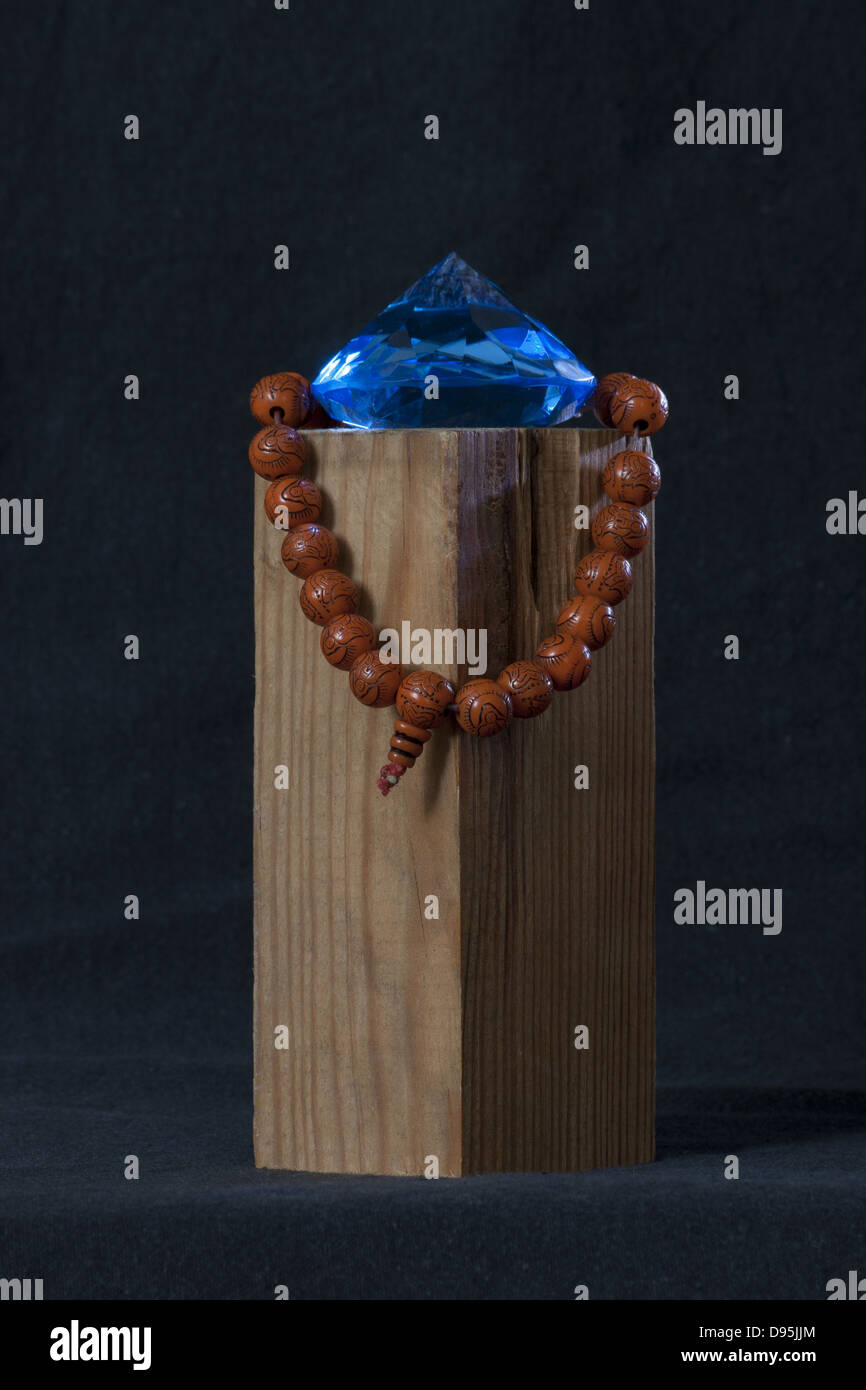 Still life with buddhist mala and blue crystal Stock Photo - Alamy