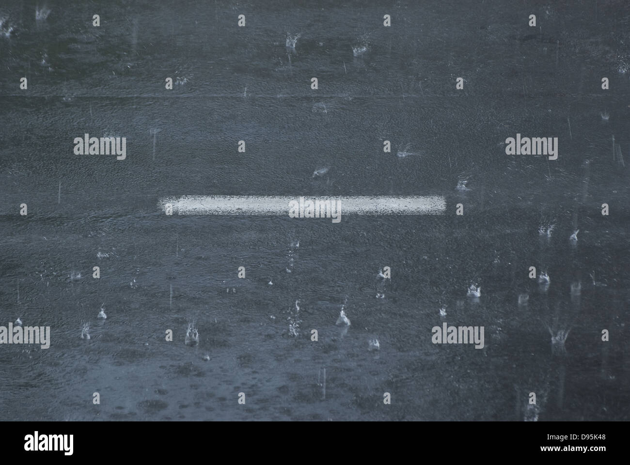 Street line in rain Stock Photo - Alamy