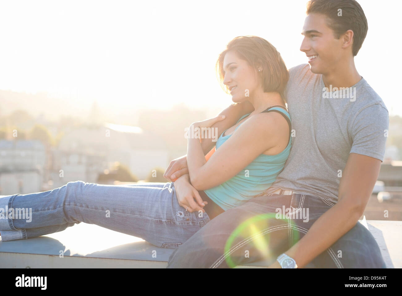 Two people sit on roof hi-res stock photography and images - Alamy